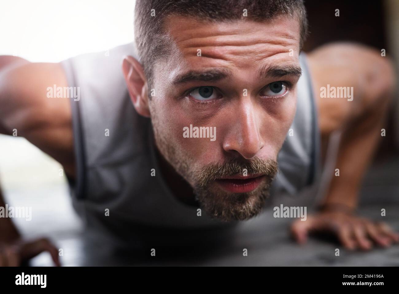 Build your dream body from the ground up. a handsome young sportsman ...