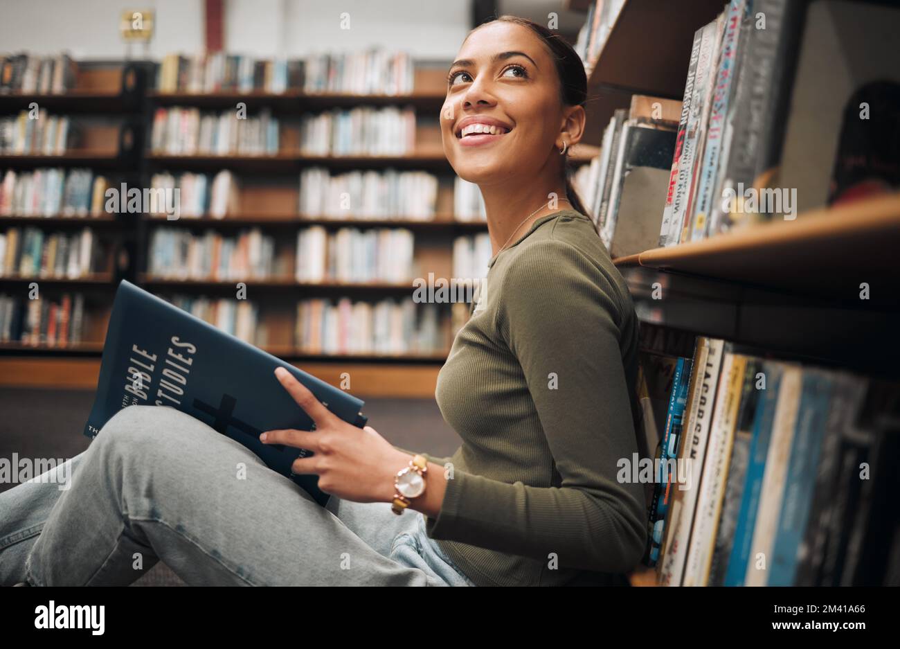 Student, thinking and reading books library floor for knowledge, college education and research ...