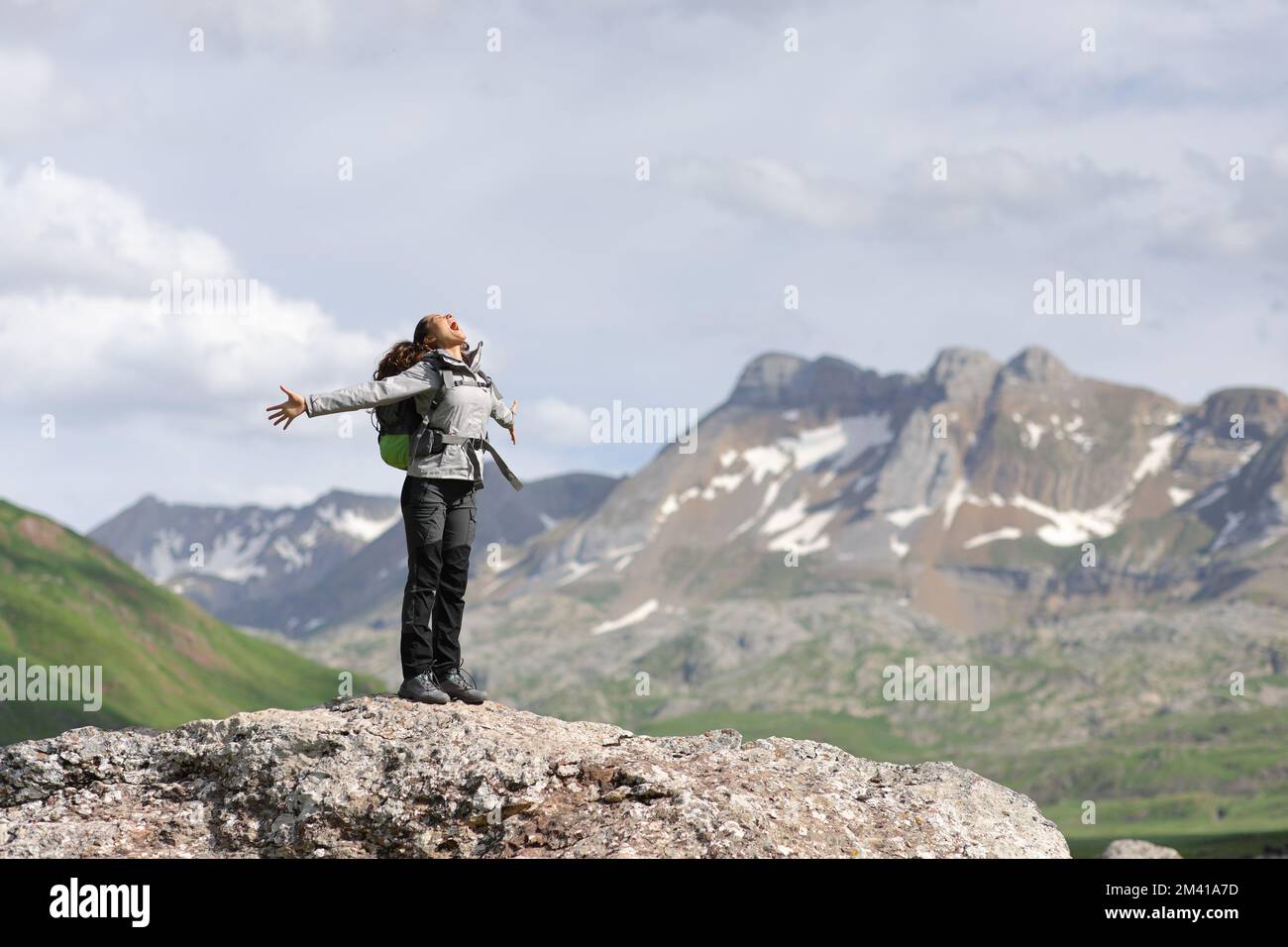 Full body portrait of an excited hiker celebrating success ...
