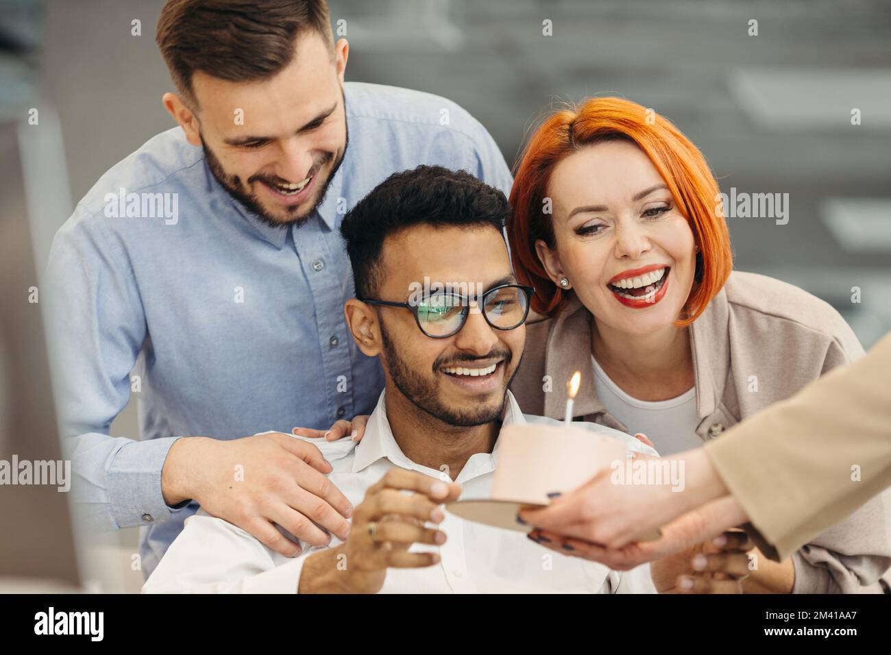 Colleagues celebrating a birthday in the office Stock Photo - Alamy
