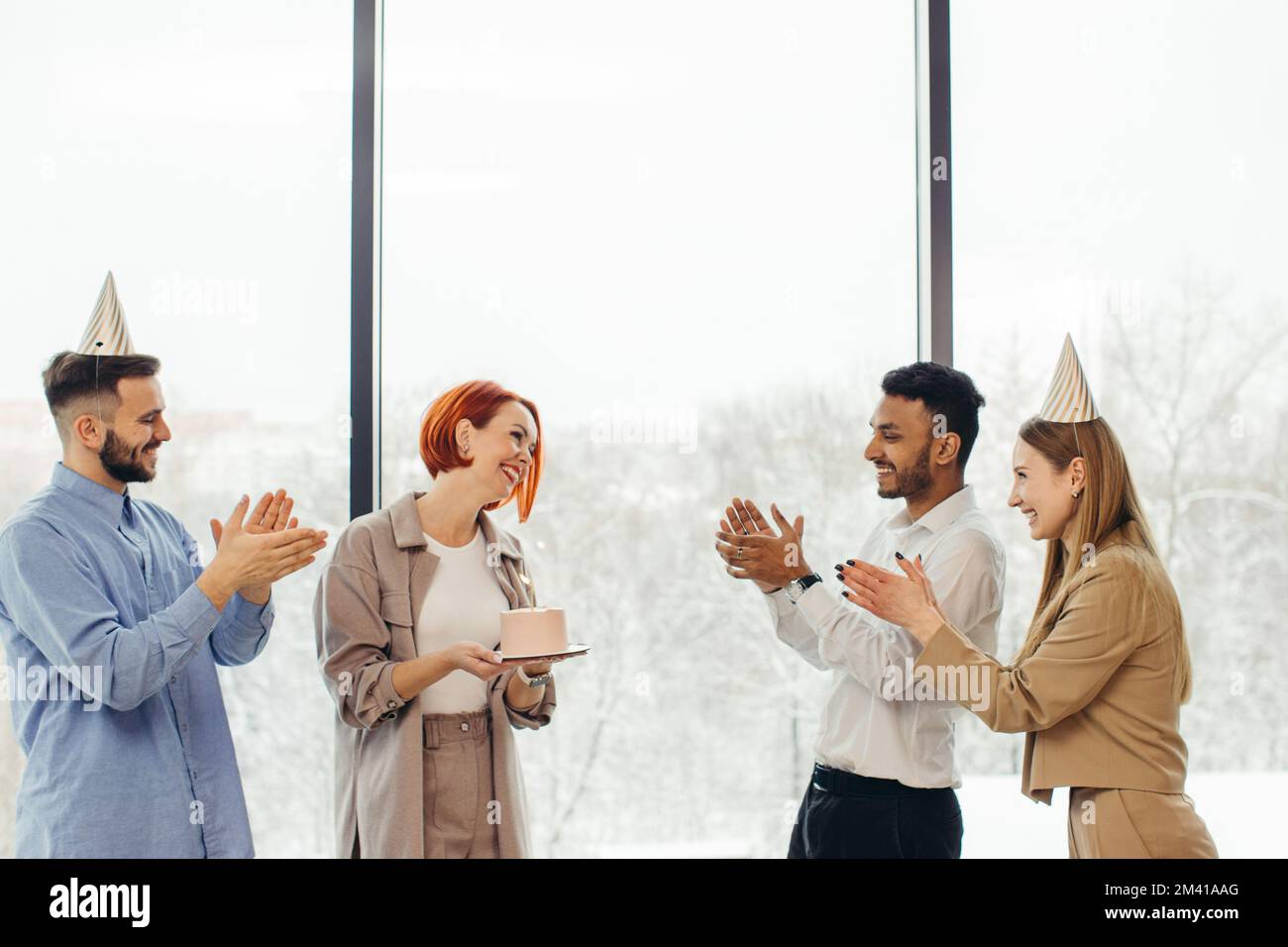 Colleagues celebrating a birthday in the office Stock Photo - Alamy
