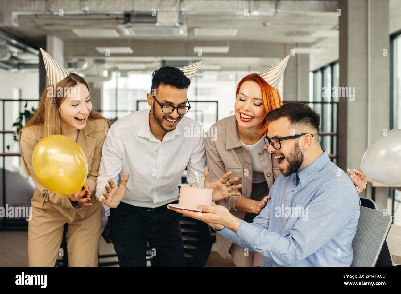 Colleagues celebrating a birthday in the office Stock Photo - Alamy