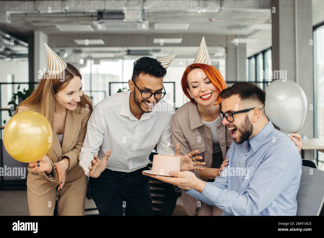 Colleagues celebrating a birthday in the office Stock Photo - Alamy