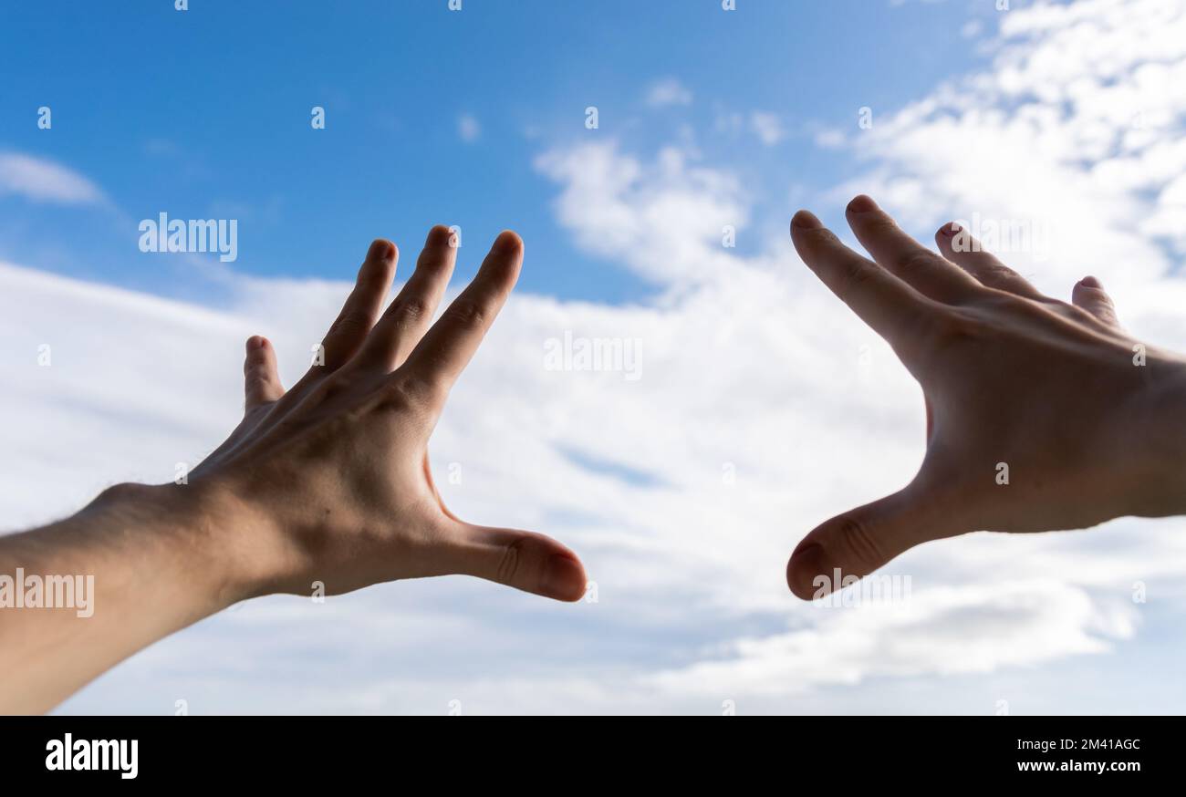 Hands reaching to sky hi-res stock photography and images - Alamy