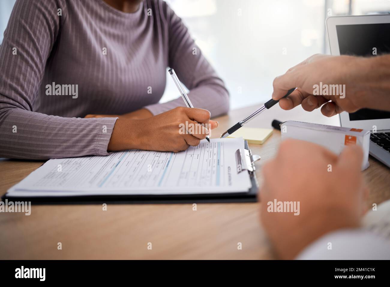 Doctor, patient and hands sign documents, notes and paperwork for life ...