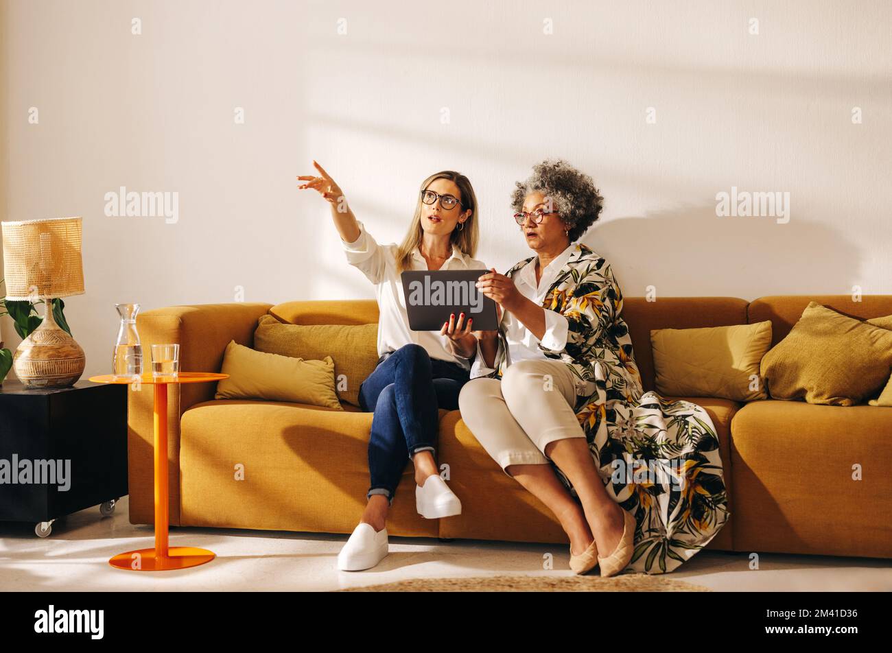 Creative interior designers discussing a new idea while sitting in an ...