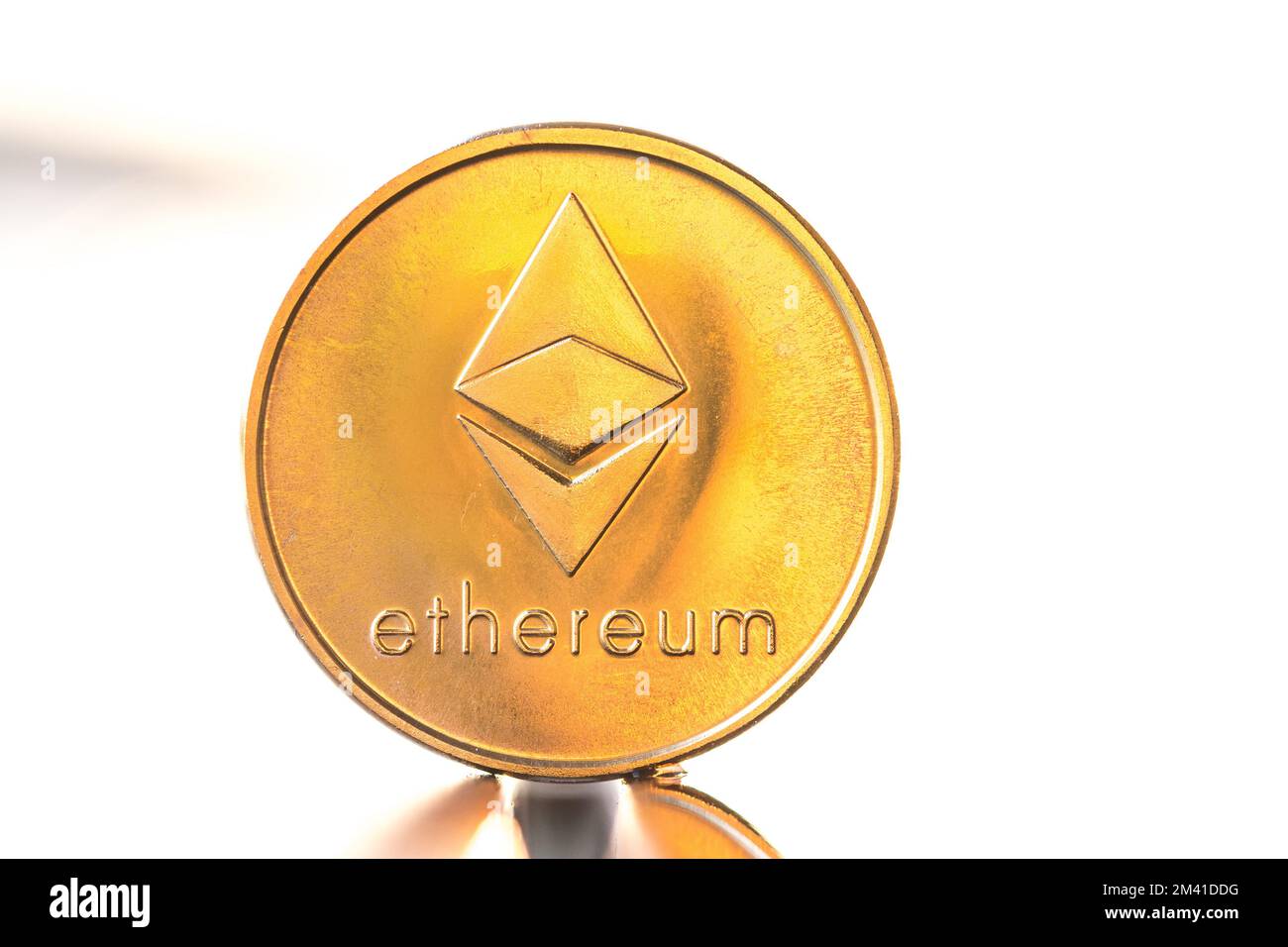 Ethereum gold color coin with sunset white background. Cryptocurrency ...