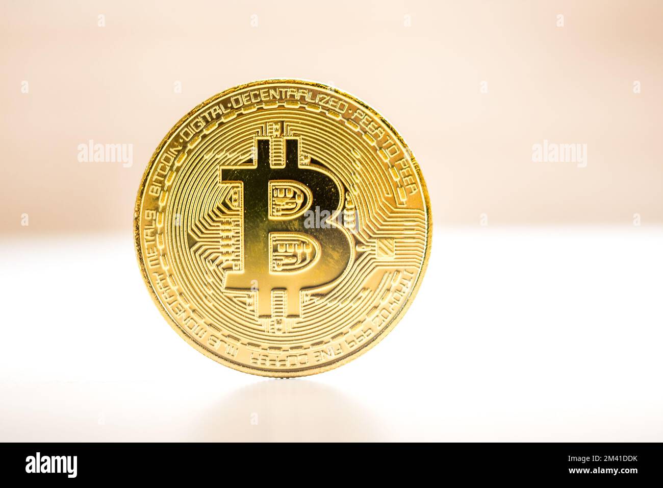 Bitcoin gold coin placed on white and brown background. Gold coin of ...
