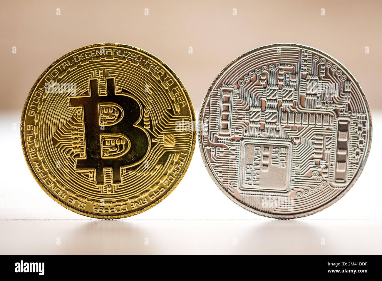 Bitcoin gold and silver coin placed on white brown background. Coin ...