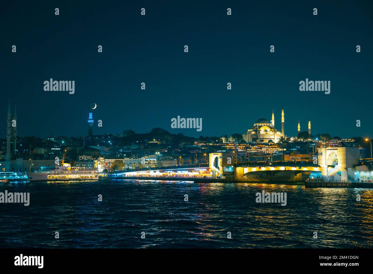 Cityscape of Istanbul at night with crescent moon. Ramadan background ...