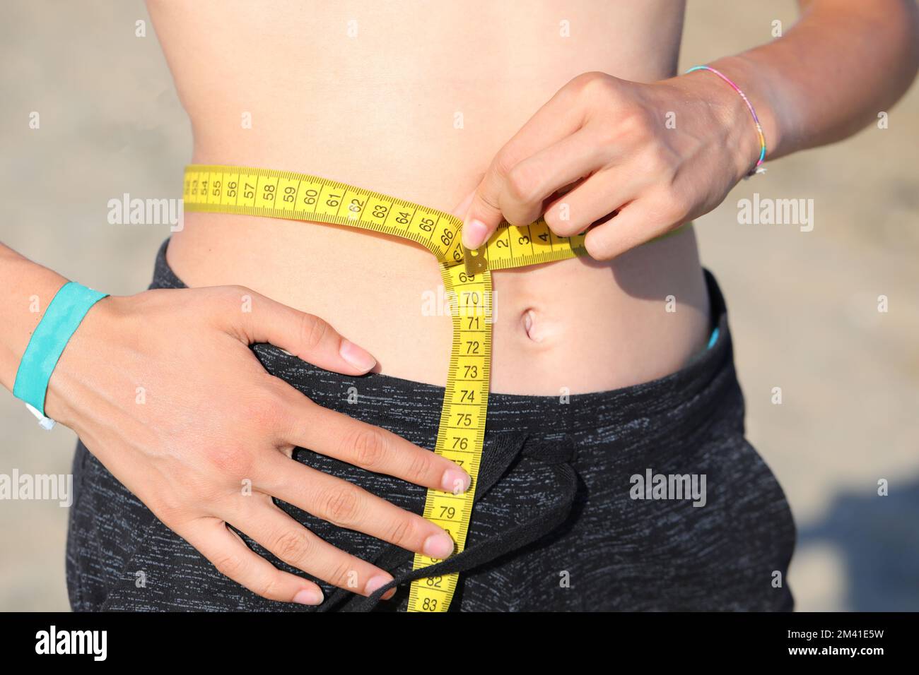 young girl belly waist measurement with tape measure and measure in ...