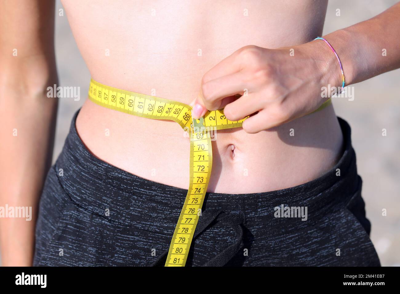 young girl belly waist measurement with tape measure and measure in ...