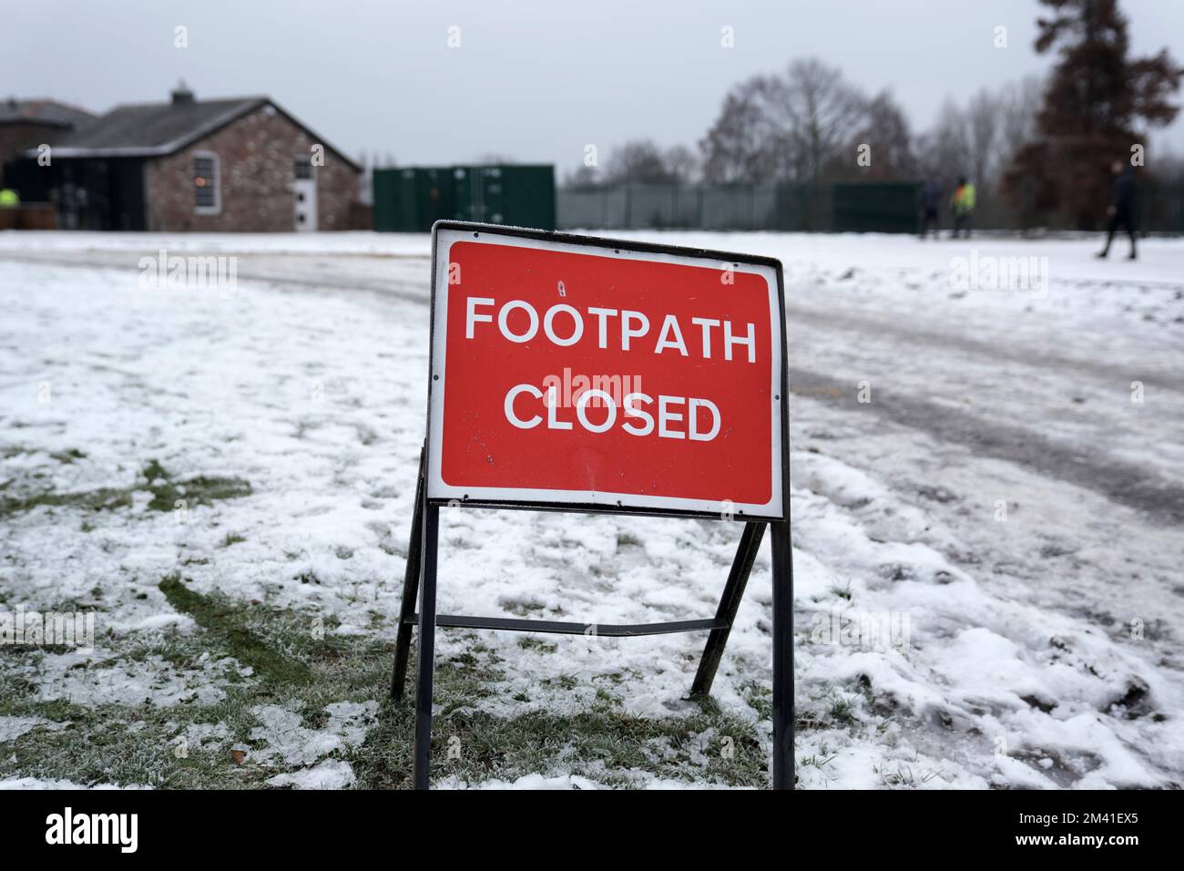 Footpath closed sign due to snow and ice Stock Photo - Alamy