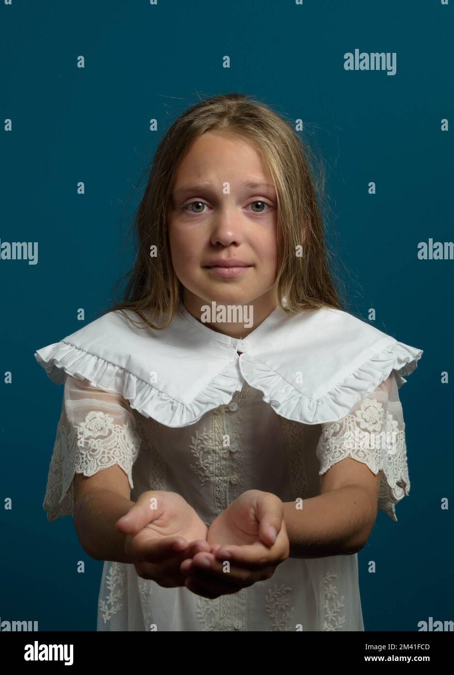 Unhappy child. Need help emotion. Long hair well dressed young girl ...