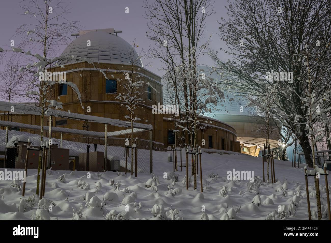 Silesian Planetarium during the blue hour. Beautiful winter scenery ...