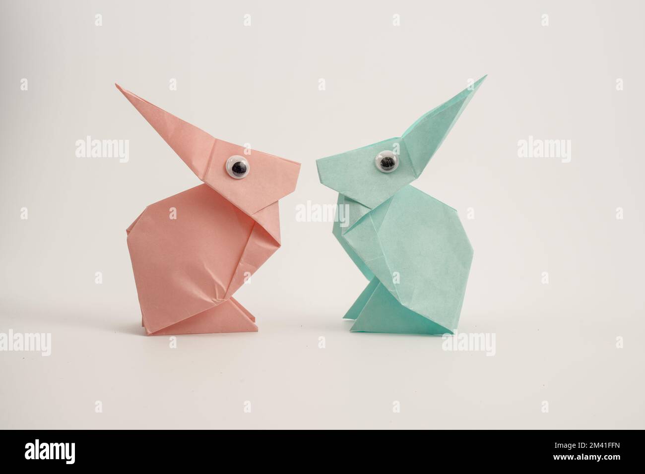 pastel pink and green paper origami hares rabbits with googly eyes ...