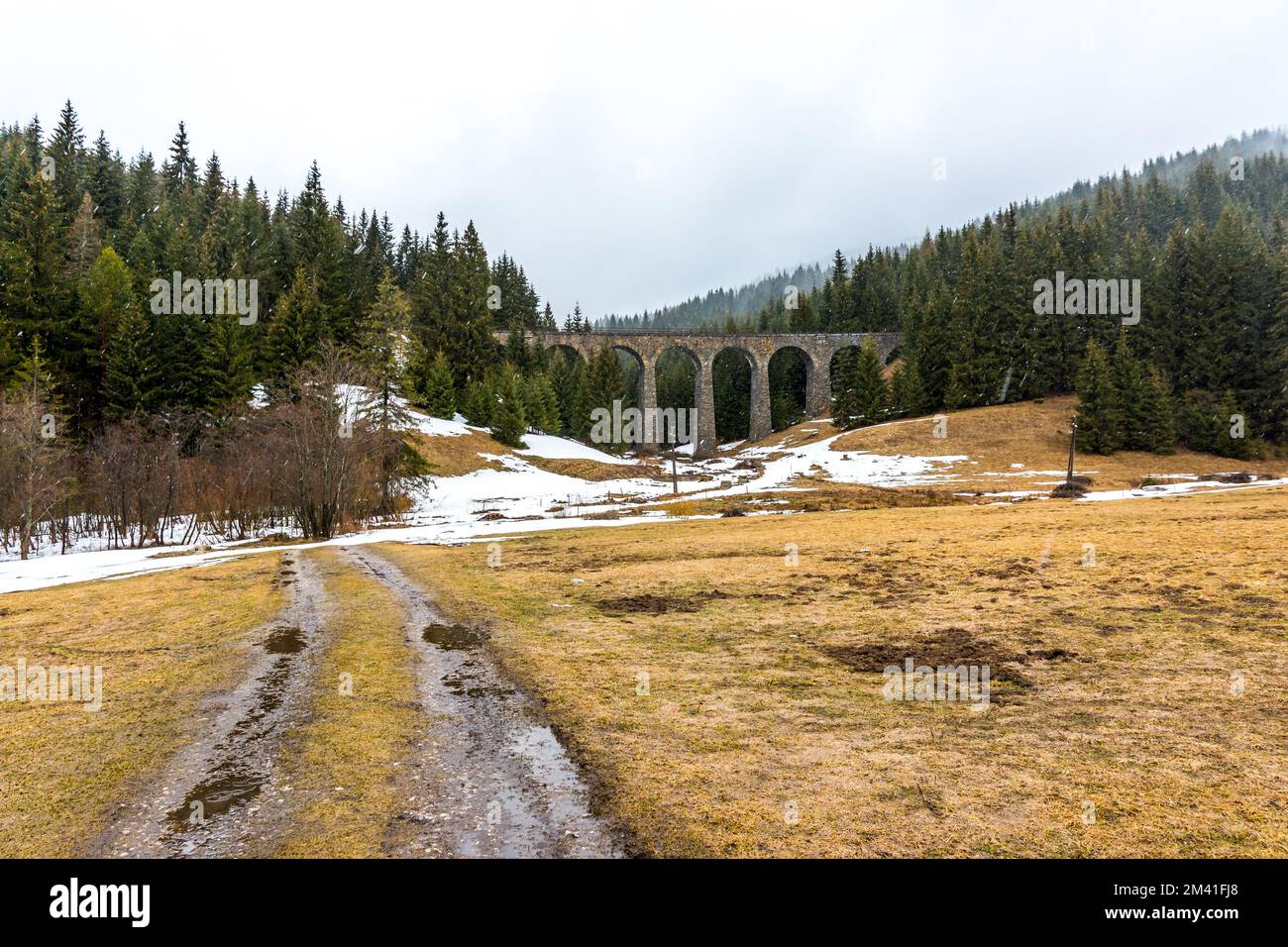 Old train with snowy mountains hi-res stock photography and images - Alamy