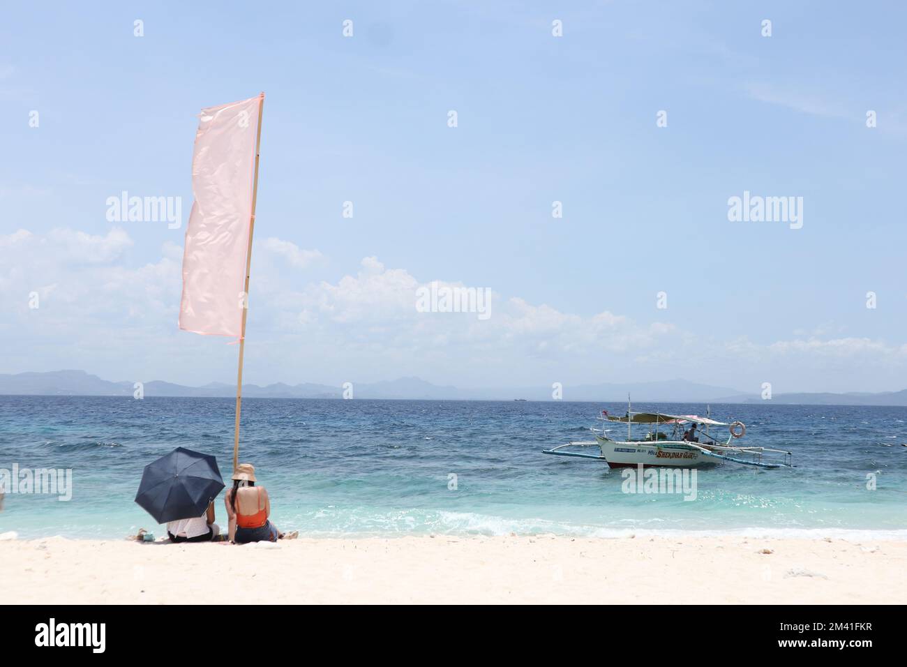 A natural view of the long white beach in Fortune Island, Nasugbu ...