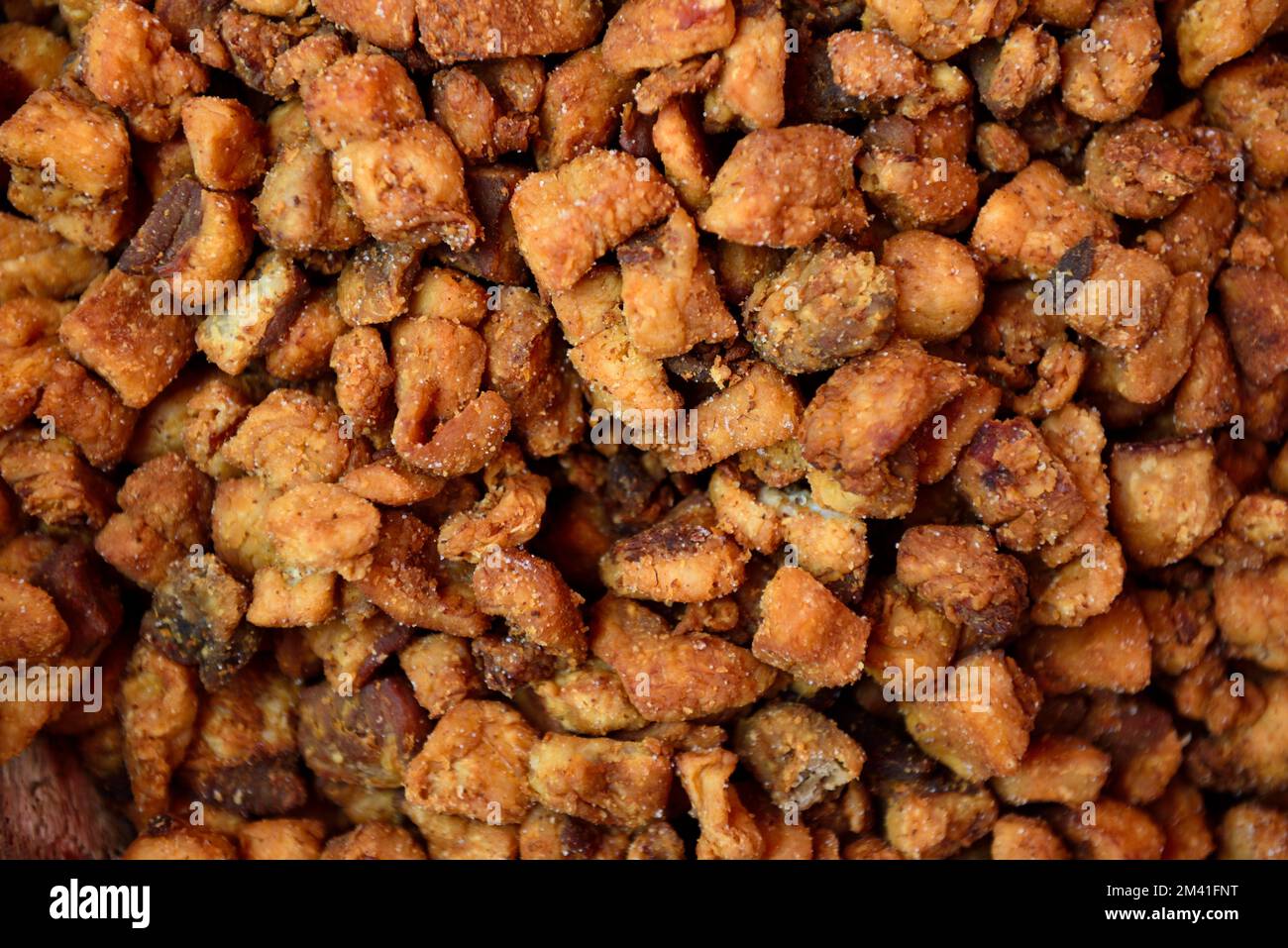 A close up fried salty boar pork greaves cut into pieces Stock Photo ...