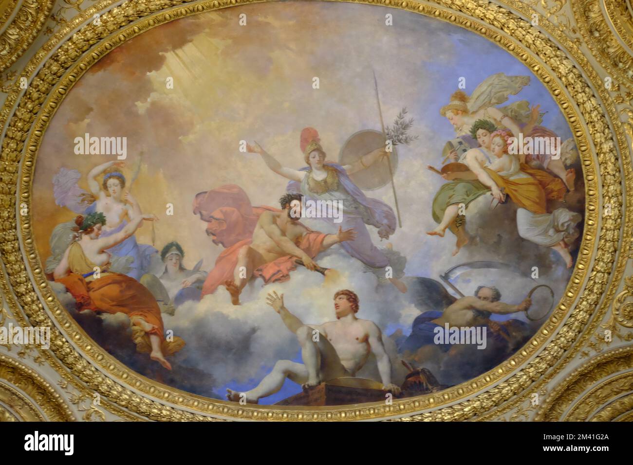 A low-angle shot of Ceiling Fresco in Louvre Museum in Paris France ...