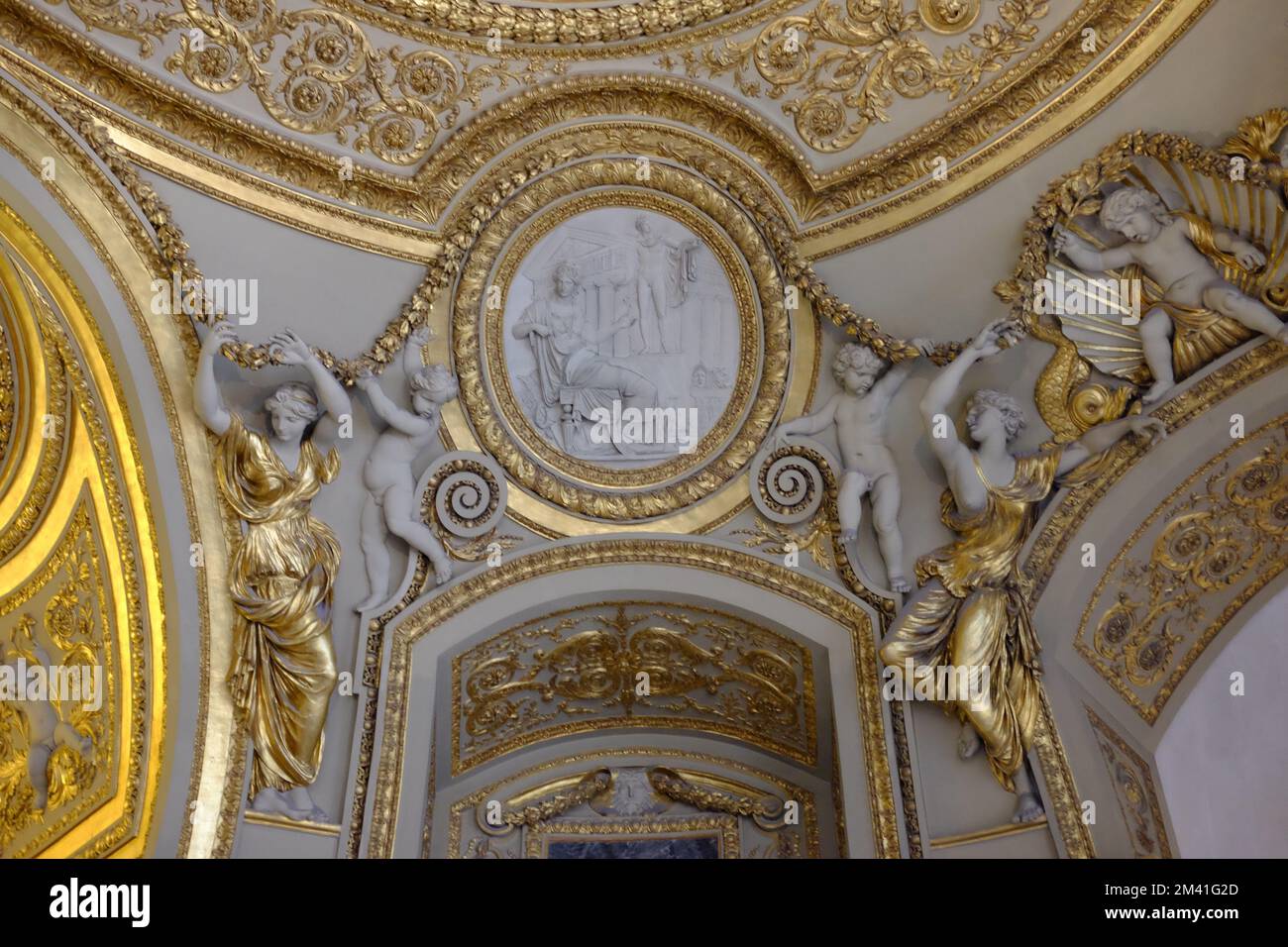 A low-angle shot of Ceiling interior details in Louvre Museum in Paris ...