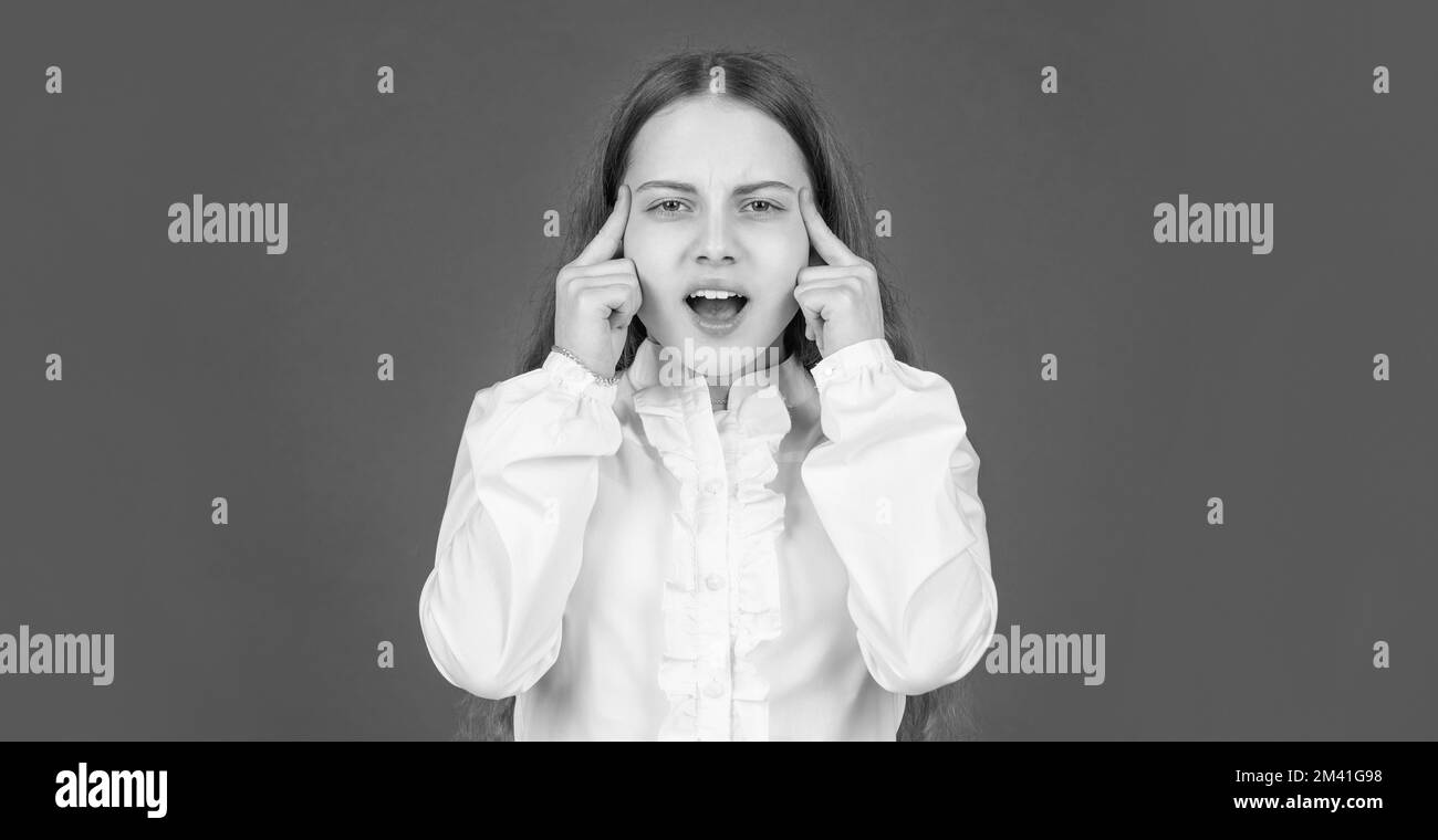 pondering kid in white shirt on red background. childhood. thinking ...