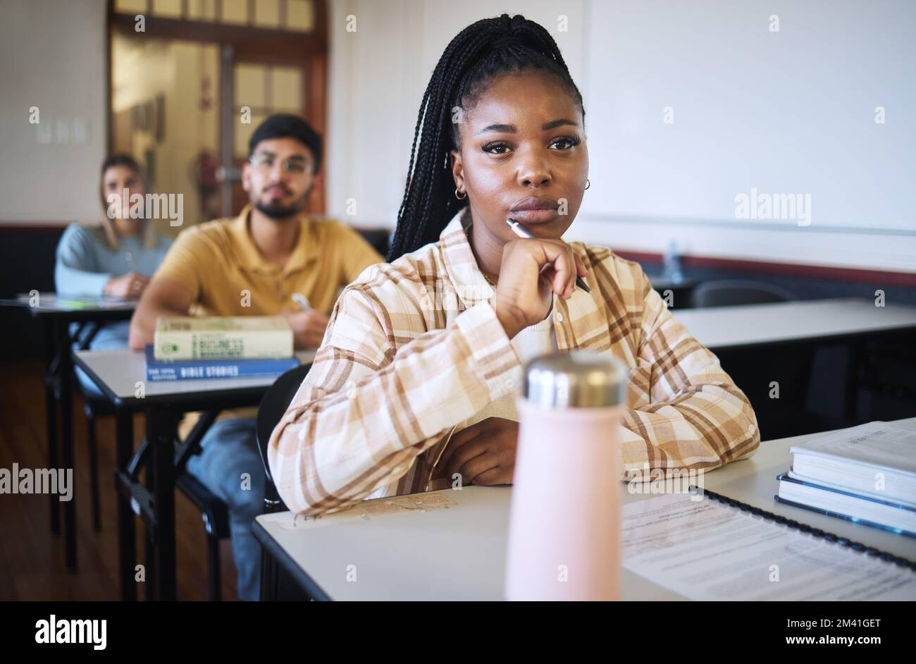 University, education and thinking with a student black woman in class ...