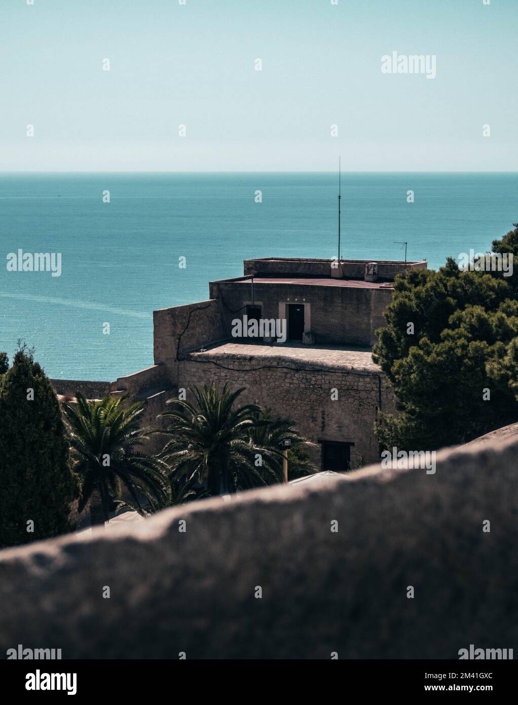An old stone house on a hill facing the sea Stock Photo - Alamy