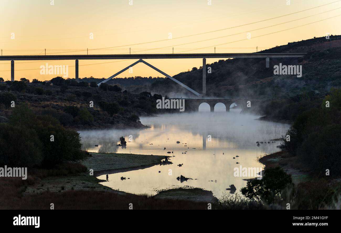 High speed train bridge over the mist Stock Photo - Alamy