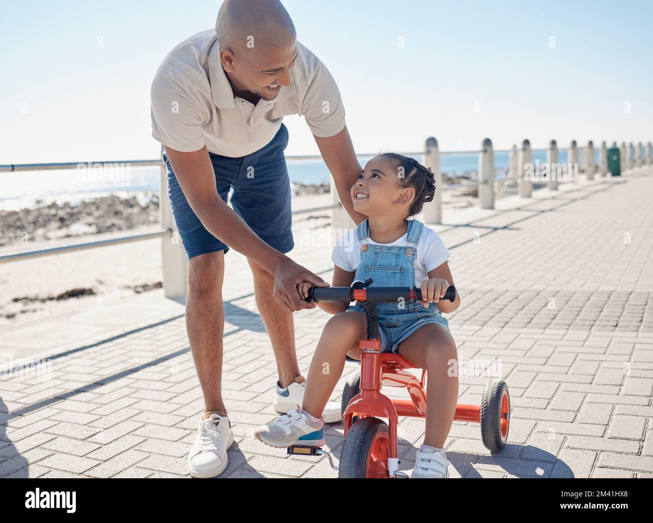 Happy girl with tricycle hi-res stock photography and images - Alamy