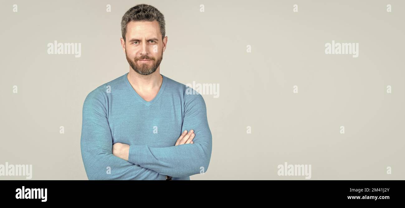Man face portrait, banner with copy space. handsome man in casual wear has grizzled hair ...