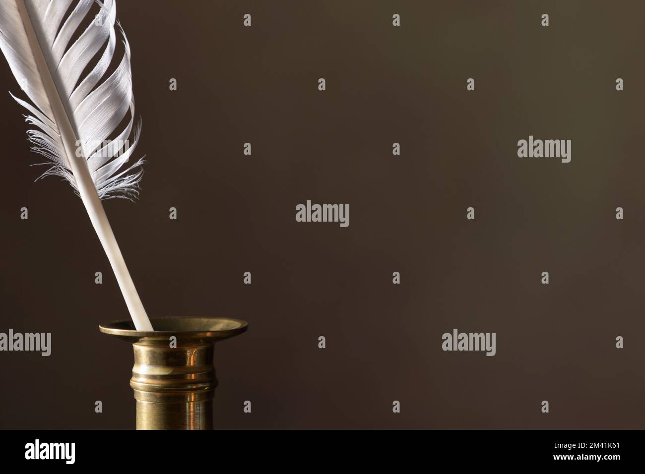 Inkwell and quill pen on a dark background. Vintage concept for ...