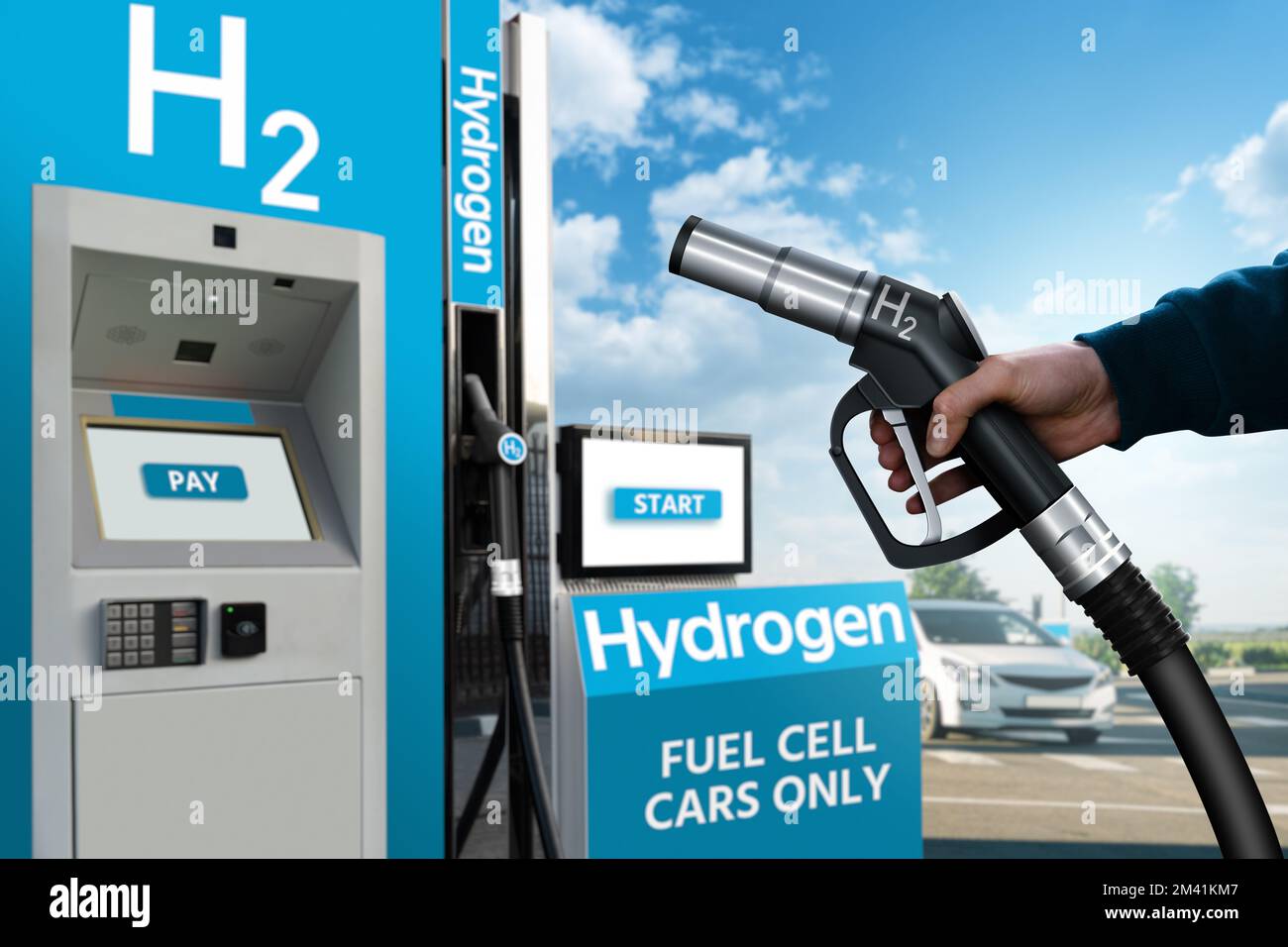Hand with H2 nozzle on a background of hydrogen filling station. Clean ...