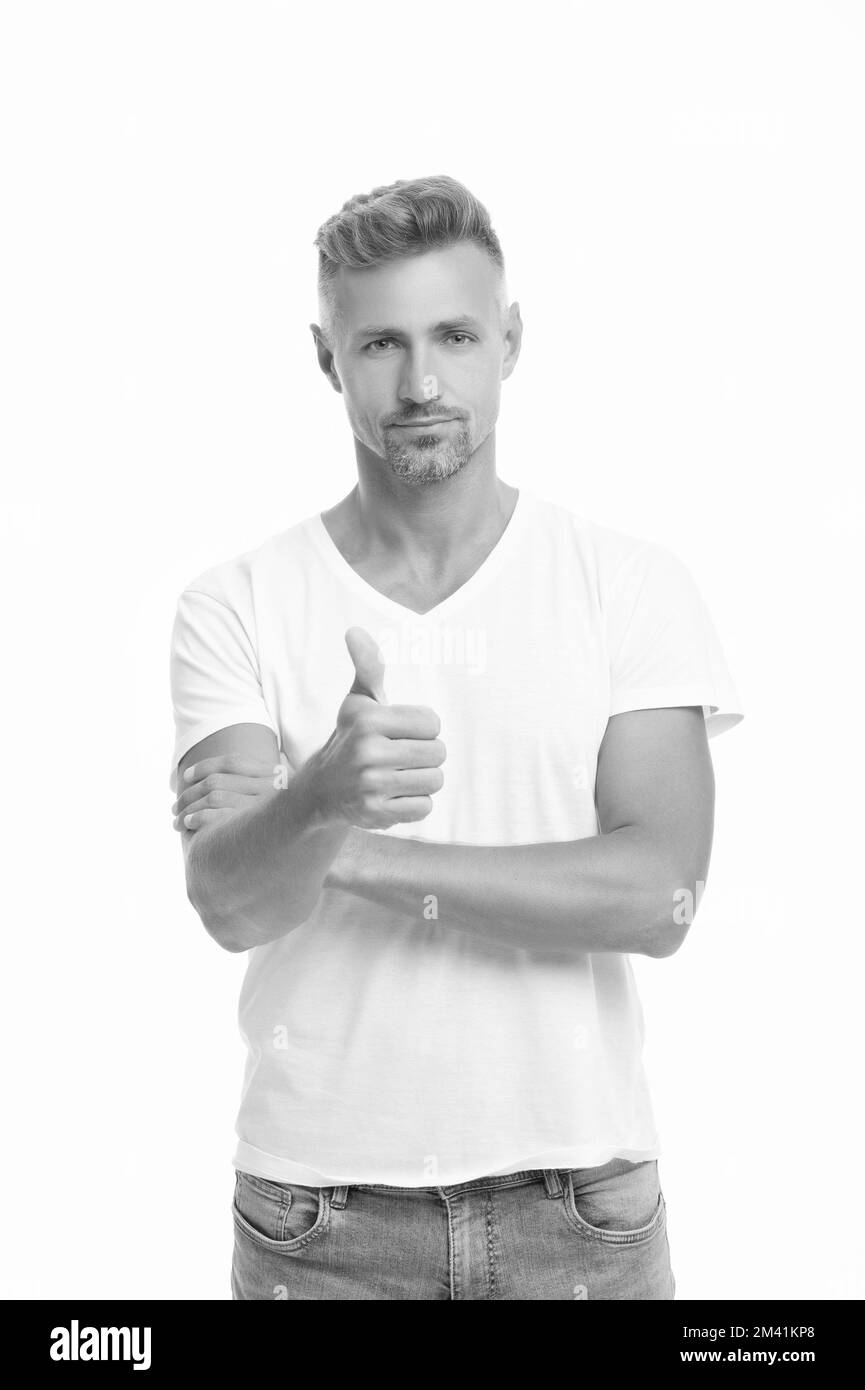 Thumbs up. Serious guy give thumb. Handsome man show approval sign ...