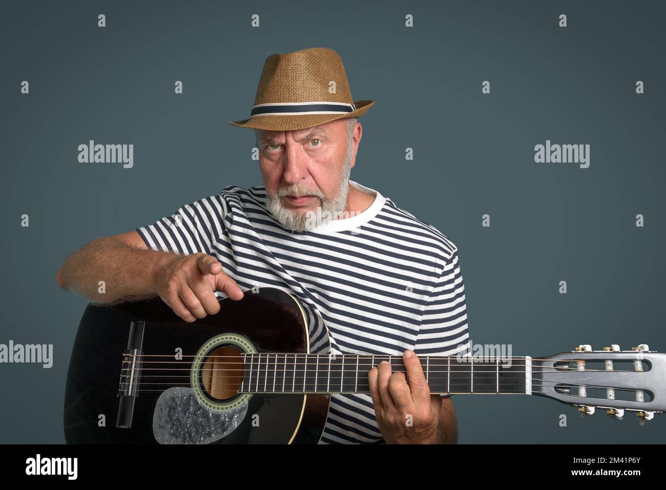 An angry music teacher. Learning to play the guitar Stock Photo - Alamy
