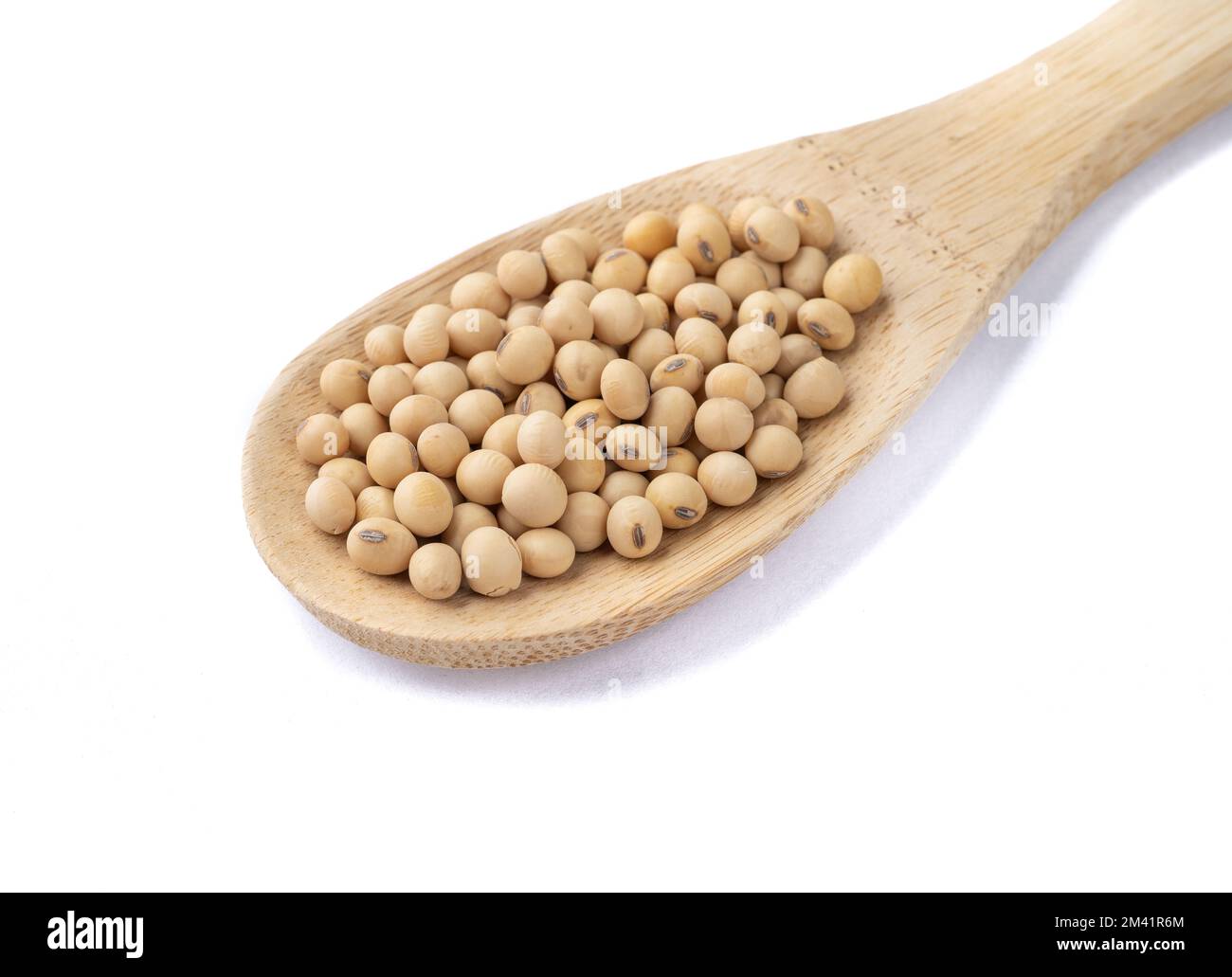 Uncooked soy beans in a spoon isolated over white background Stock ...