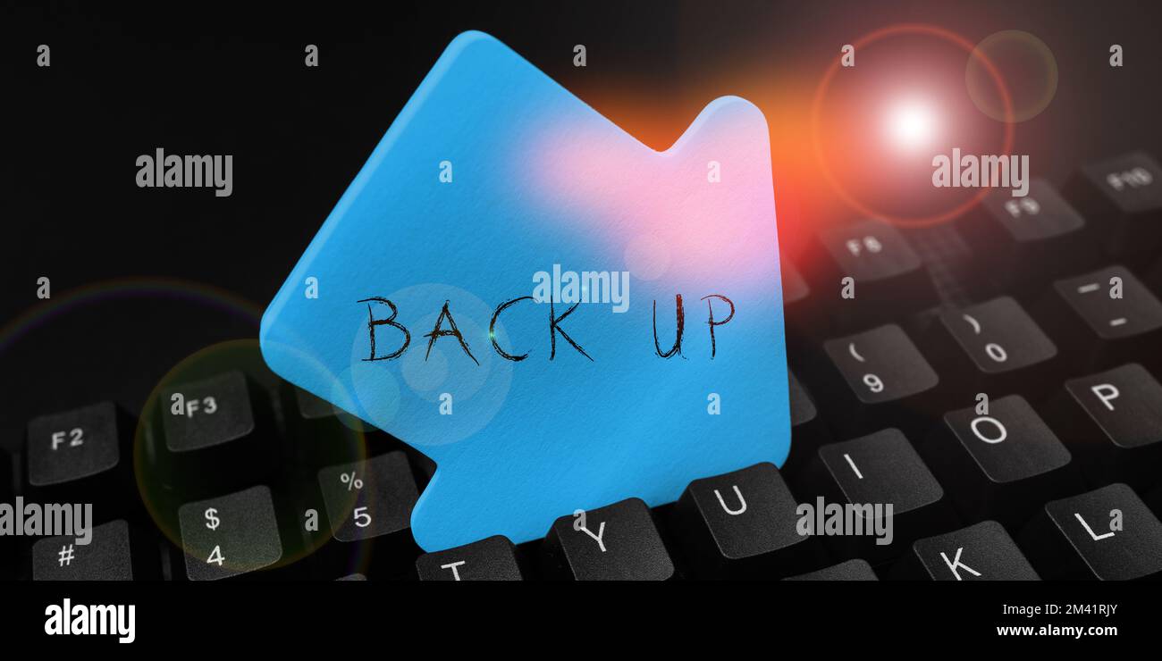 Hand writing sign Back Up. Conceptual photo saving important data into ...