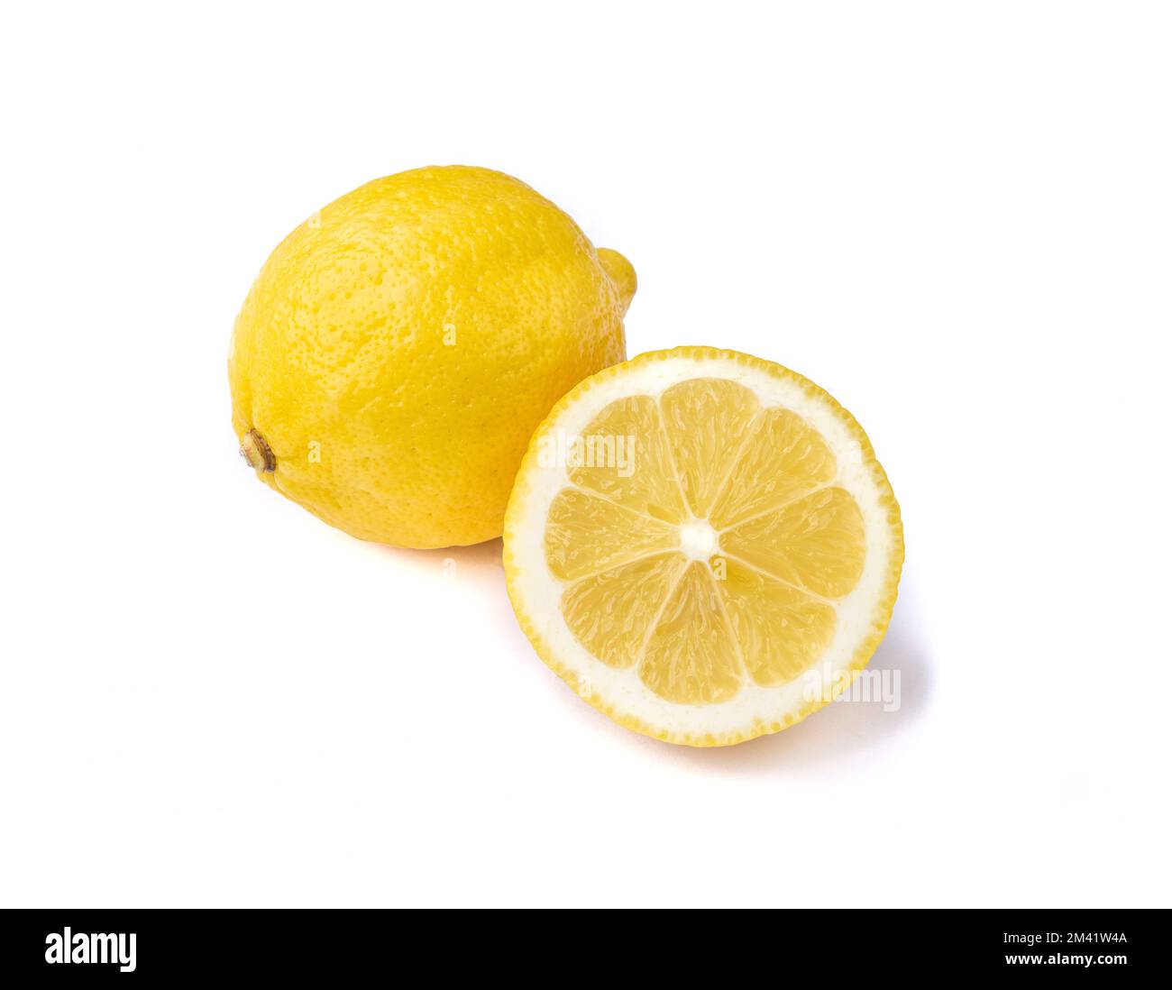 Sicilian lemons and half fruit isolated over white background Stock Photo - Alamy