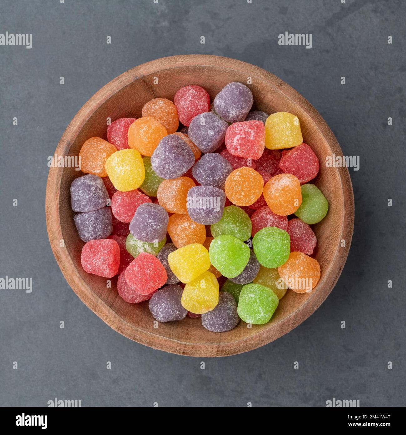 Colorful gum drop candies over stone background Stock Photo - Alamy