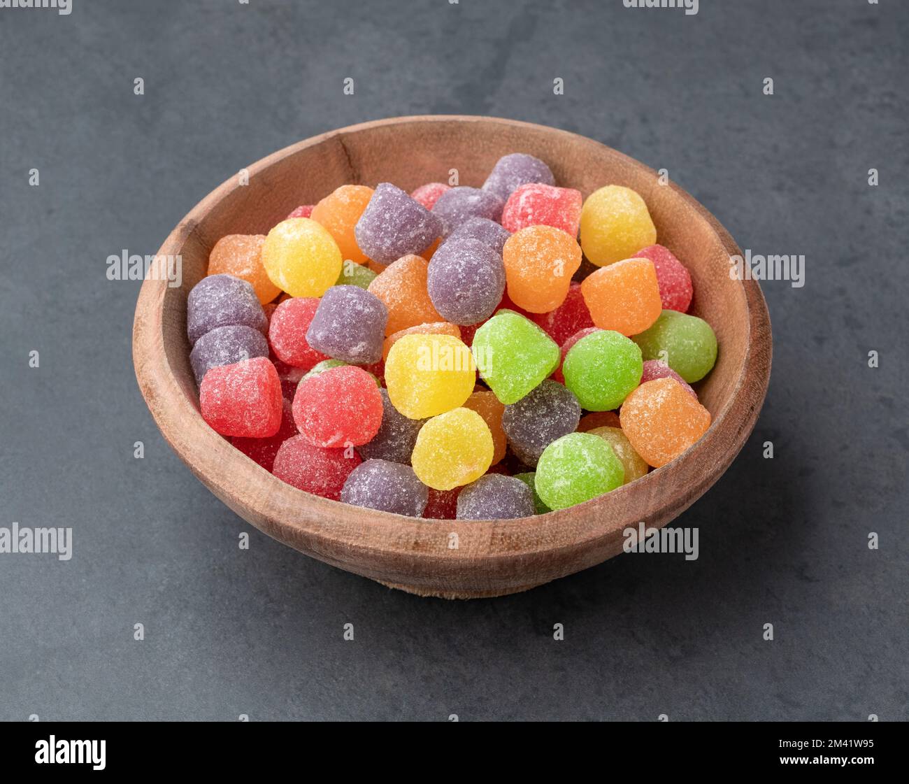 Colorful gum drop candies over stone background Stock Photo - Alamy