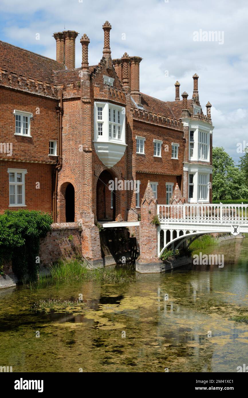 summer view of Moated Helmingham Hall entrance with drawbridge with ...