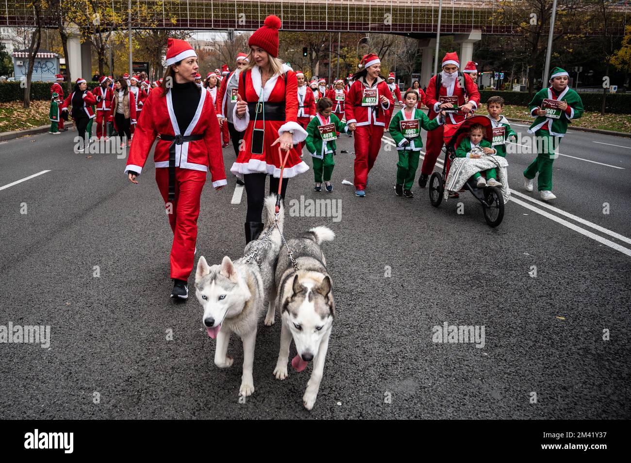 Madrid, Spain. 18th Dec, 2022. People dressed as Santa Claus are seen ...