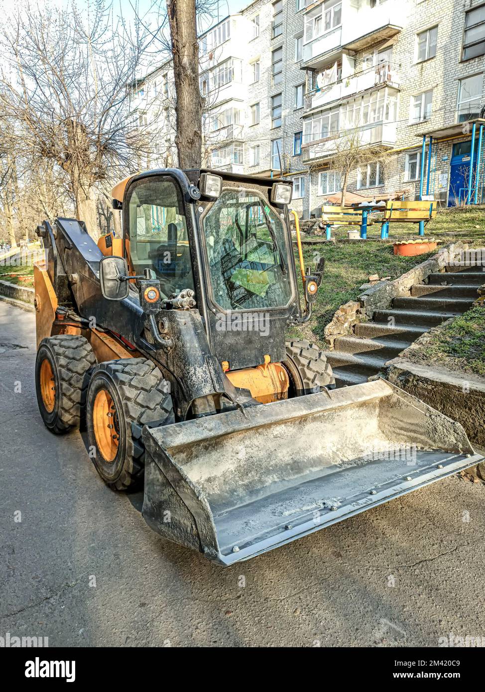 Small front-end loader for loading and unloading on city streets Stock ...