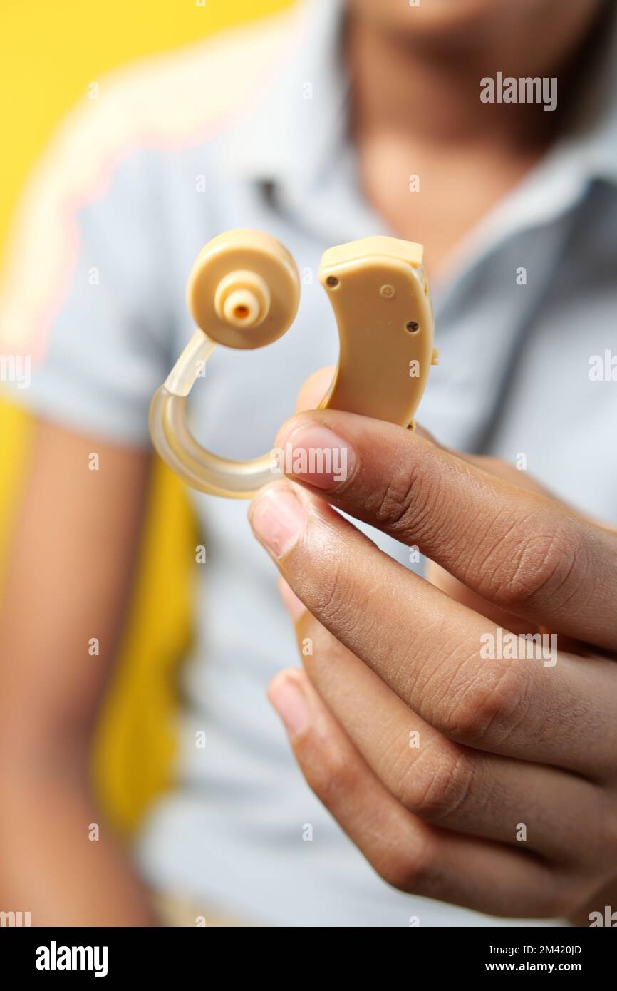 Hearing aid concept, teenage boy with hearing problems Stock Photo - Alamy