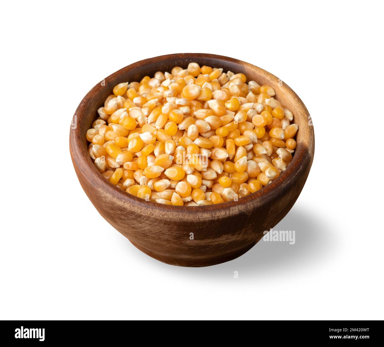 Dried corn or popcorn grains in a bowl isolated over white background ...