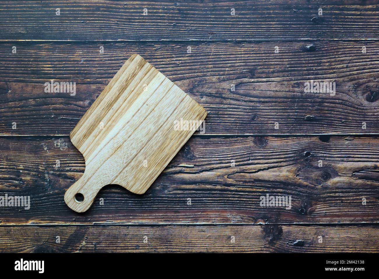 wooden chopping board on black background top down Stock Photo - Alamy