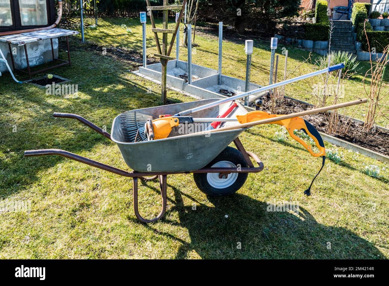 Garden tools in a wheelbarrow 01 Stock Photo - Alamy