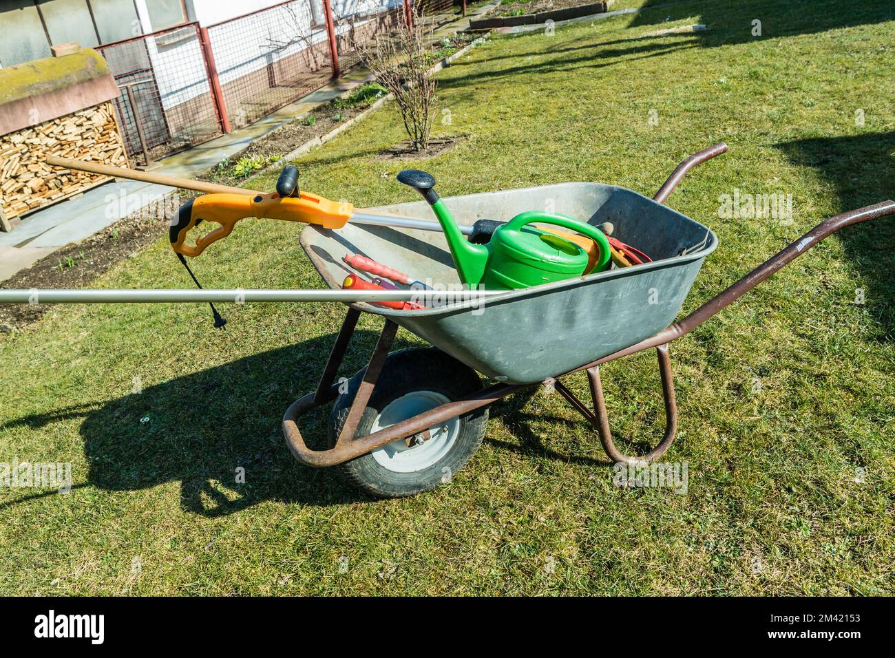 Garden tools in a wheelbarrow 02 Stock Photo - Alamy