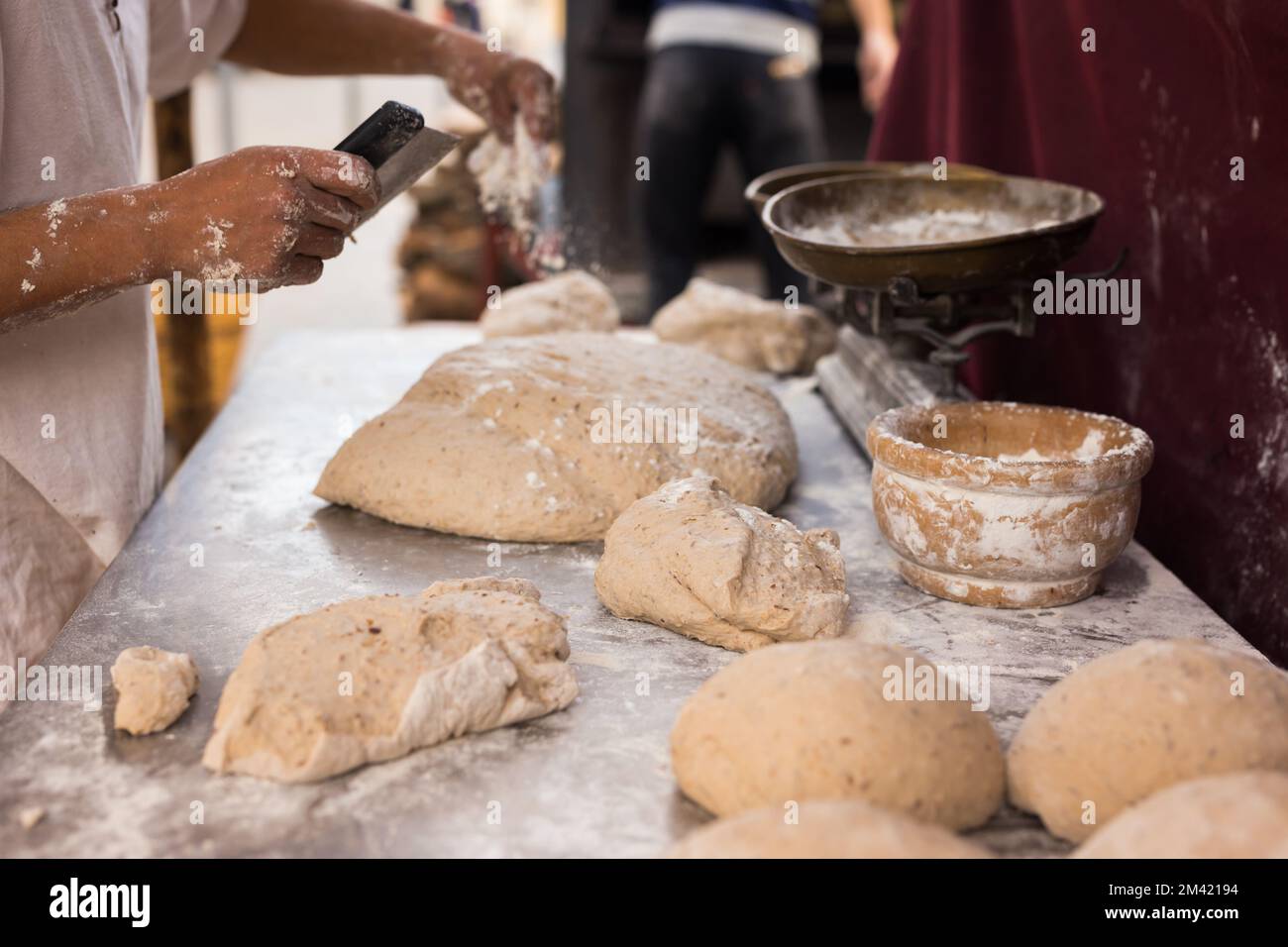 yeast dough in the form of loaves waiting to be cooked Stock Photo - Alamy