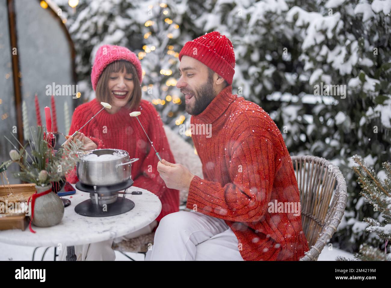 Young family have romantic dinner during winter holidays outdoors Stock ...